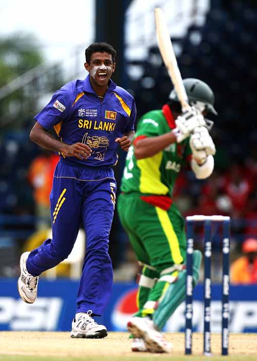 Farveez Maharoof celebrates the wicket of Mushfiqur Rahim ...