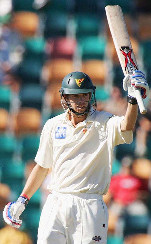 Luke Butterworth acknowledges the applause on reaching 50 ...