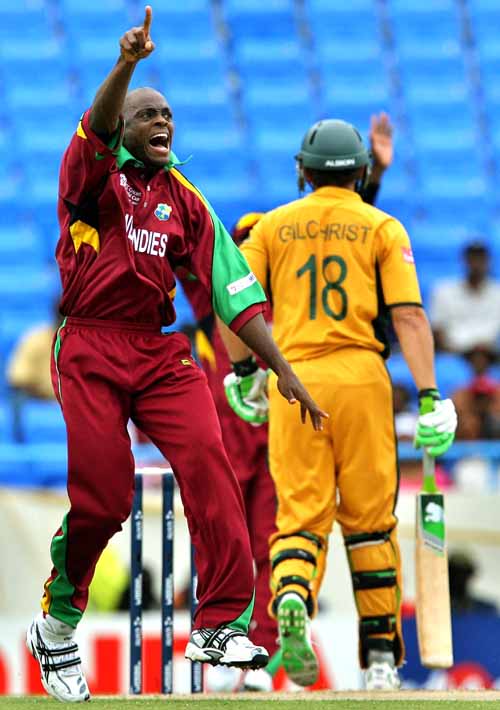 Daren Powell celebrates the wicket of Adam Gilchrist | ESPNcricinfo.com