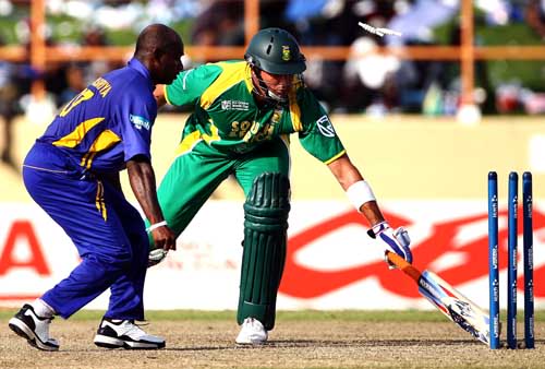 Justin Kemp gets back in his crease after a direct shot hits his stumps ...