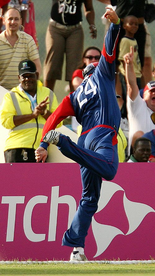 Kevin Pietersen takes a stunning running catch at deep midwicket...before momentum took him over ...
