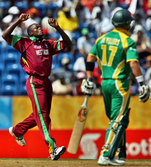 Daren Powell reacts to a close call for the wicket of AB de Villiers ...