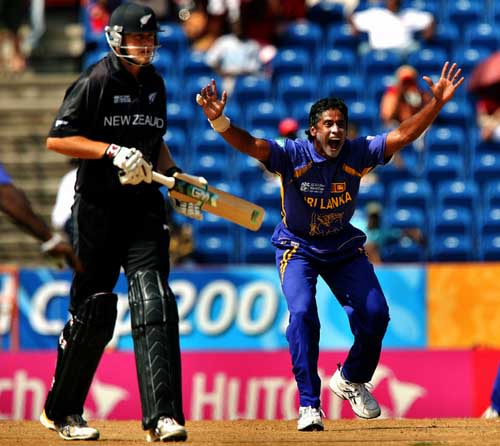 Chaminda Vaas appeals successfully for the wicket of Stephen Fleming as Peter Fulton looks on ...