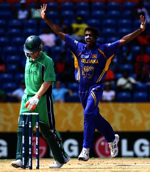 Farveez Maharoof celebrates the wicket of Eoin Morgan who was out for a ...