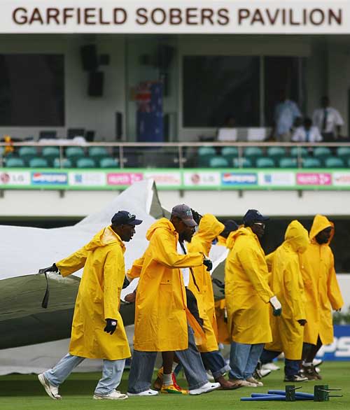 Ground staff were kept busy as rain caused problems in Barbados ...