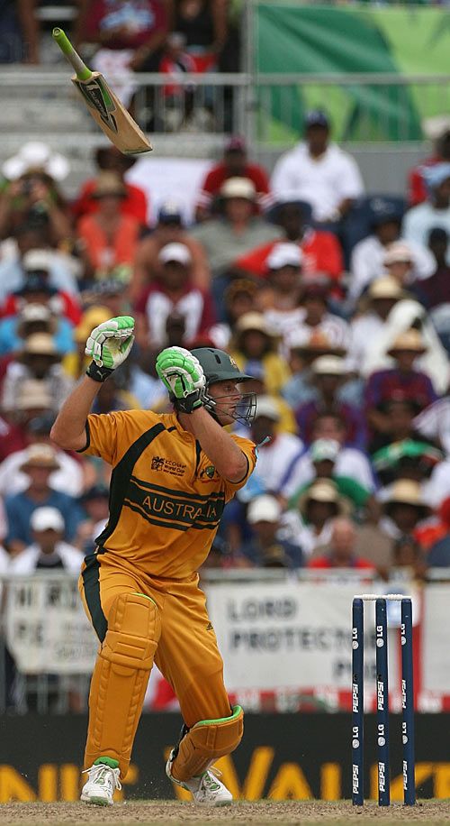Adam Gilchrist loses his bat while driving | ESPNcricinfo.com