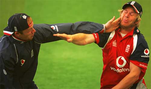 Happy slapping: Andrew Flintoff and Matthew Hoggard pile in at practice ...