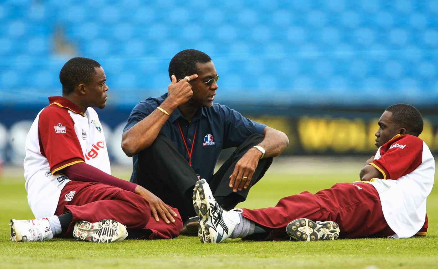 Michael Holding talks with Daren Powell (left) and Jerome Taylor ...