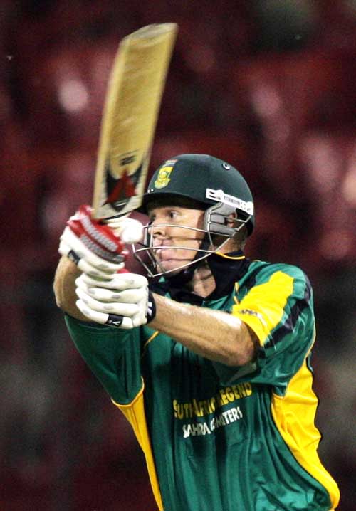 Shaun Pollock lets one to the fence on his way to a maiden one day ...