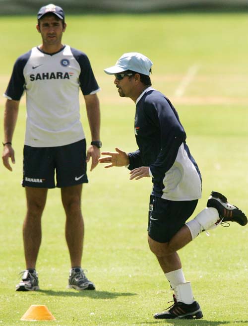 Sachin Tendulkar runs as trainer Gregory King looks on | ESPNcricinfo.com