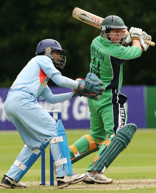 India's wicketkeeper Dinesh Karthik looks on while Gary Wilson plays a ...