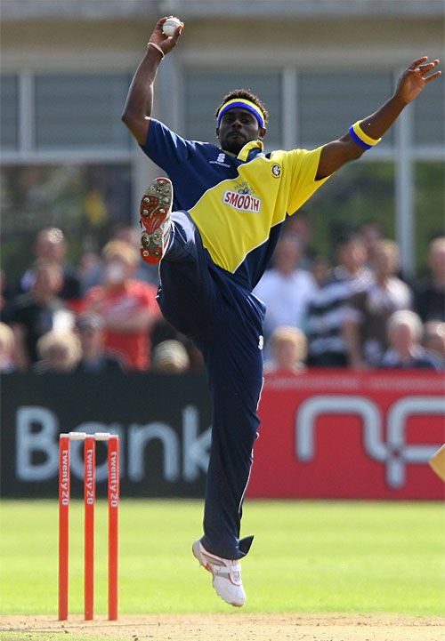 Carl Greenidge stops a return off his bowling | ESPNcricinfo.com