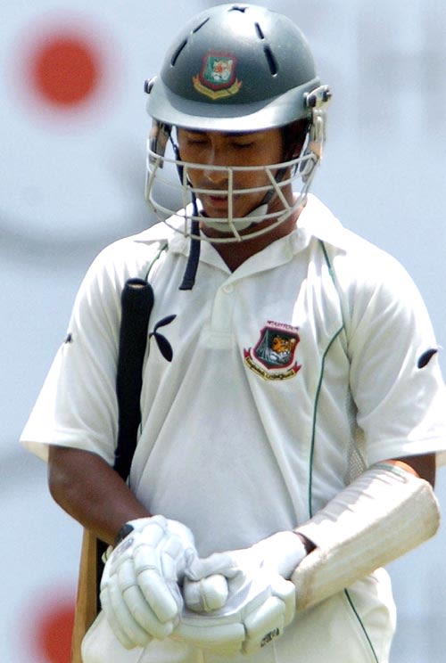 Mohammad Ashraful walks back to the pavillion after being dismissed for ...