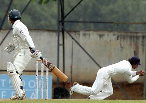 Kumar Sangakkara took a smart catch in slip to end Javed Omar's vigil ...