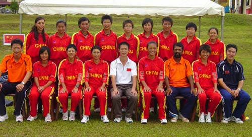 China pose for a team photograph after their win over UAE ...