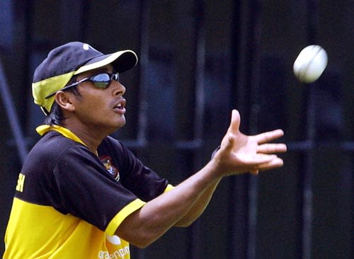 Mohammad Ashraful keeps his eyes on the ball during a practice session ...