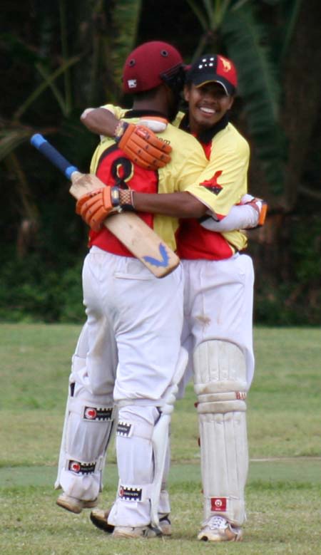 PNG Captain Colin Amini and Arua Dikana celebrate a milestone during ...