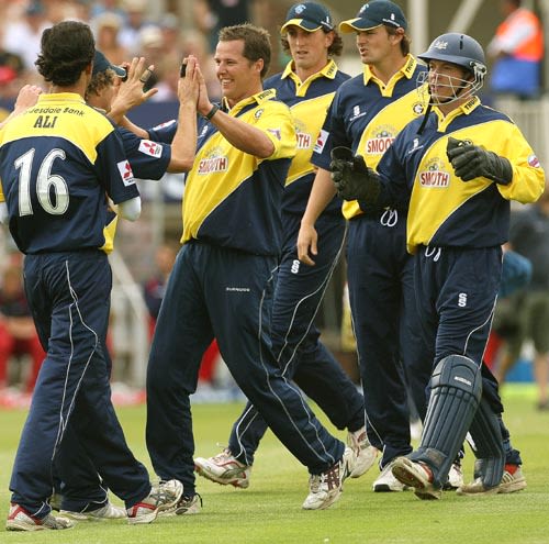 Mark Hardinges and his team-mates celebrate the wicket of Mark Chilton ...