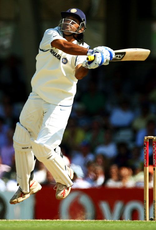 Mahendra Singh Dhoni is airborne as he smacks Monty Panesar over ...