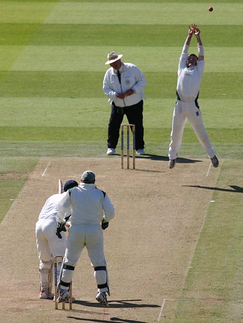 Alan Wells drives inches over the bowler | ESPNcricinfo.com