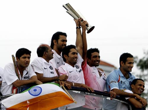Indian players greet crowds in the streets of Mumbai from atop an open ...
