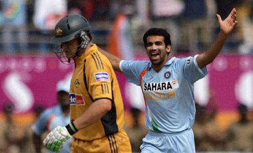 Adam Gilchrist walks back after being dismissed by Zaheer Khan ...