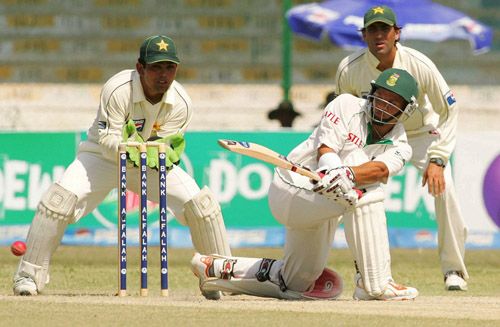 Ashwell Prince sweeps while Kamran Akmal and Younis Khan look on ...
