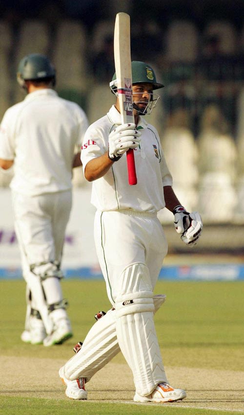 Ashwell Prince raises his bat after reaching fifty | ESPNcricinfo.com