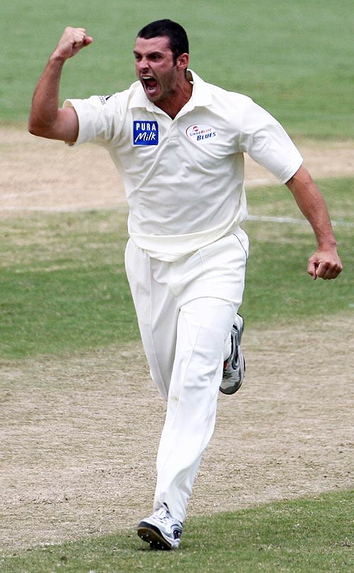 Mark Cameron celebrates one of his five wickets before lunch as he ...