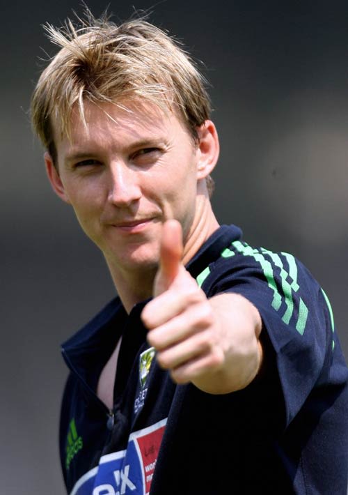 Brett Lee strikes a pose as he returns from a training session ...