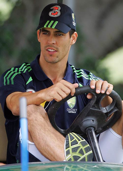 Mitchell Johnson rests on a golf cart at Australia's training session ...
