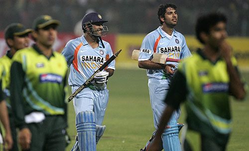 Mahendra Singh Dhoni and Yuvraj Singh walk back after winning the ...