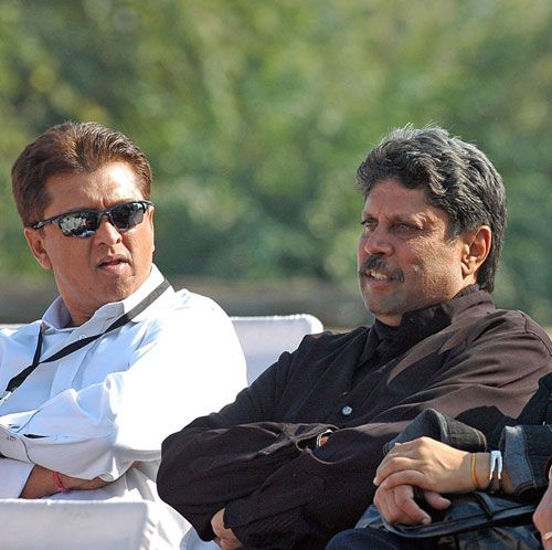 Kiran More and Kapil Dev watch the play-off for fifth place ...
