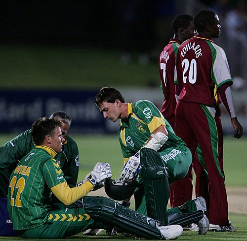 Johan Botha collects himself after he was floored by Fidel Edwards ...