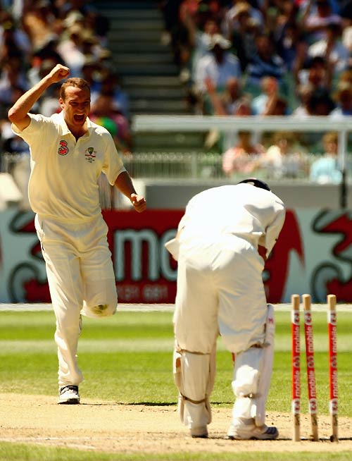 Stuart Clark is elated after Sachin Tendulkar chops one onto his stumps ...