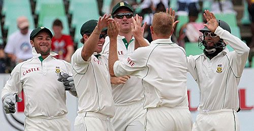 Shaun Pollock is congratulated on the wicket of Runako Morton ...
