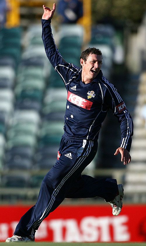 David Hussey celebrates a smart return catch | ESPNcricinfo.com