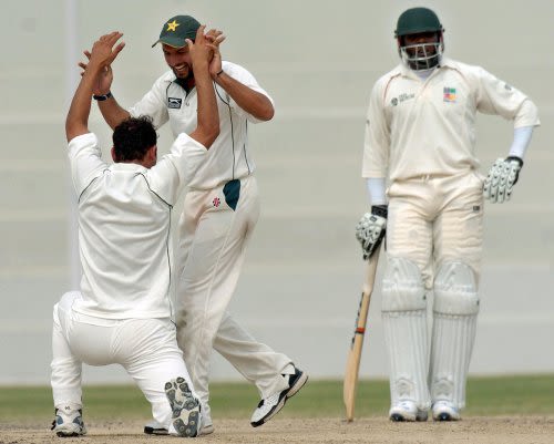 Samiullah Khan is congratulated by Shahid Afridi after he dismissed ...