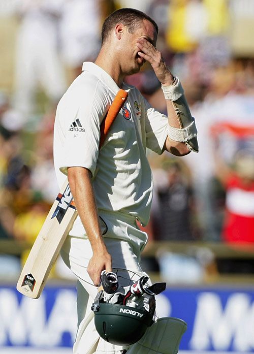 Stuart Clark walks back after nicking one to the keeper off Irfan Pathan | ESPNcricinfo.com