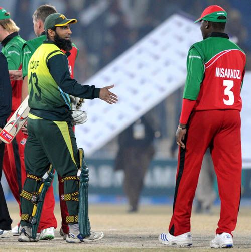 Mohammad Yousuf and Hamilton Masakadza shake hands after the game ...