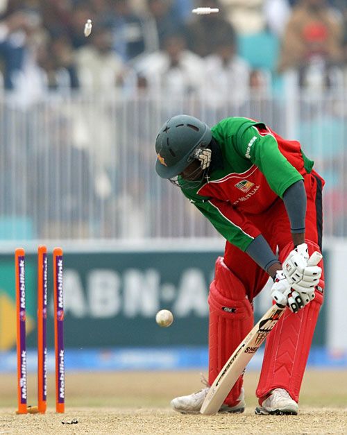 Christopher Mpofu looks back after being bowled by Abdur Rauf for a ...