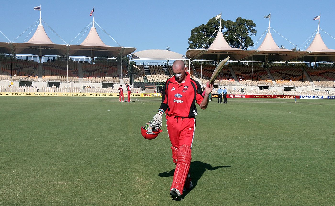 A bashful Matthew Elliott takes the applause as he leaves the field for ...