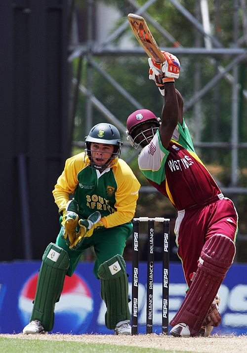 Devon Thomas lofts the ball over the covers during his 57-ball 53 ...