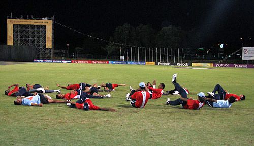 The Indian players exercise under lights at the Kinrara Oval ...
