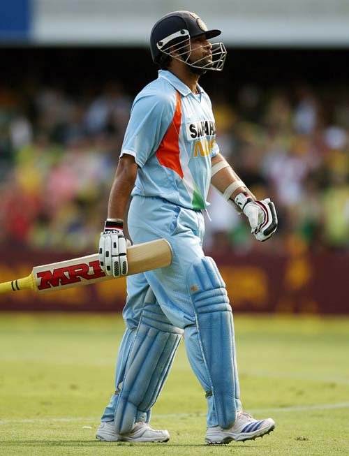 A disappointed Sachin Tendulkar returns to the pavilion after falling ...