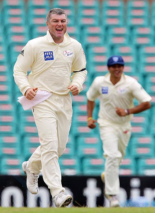 Stuart MacGill celebrates a wicket on his return to first-class cricket ...