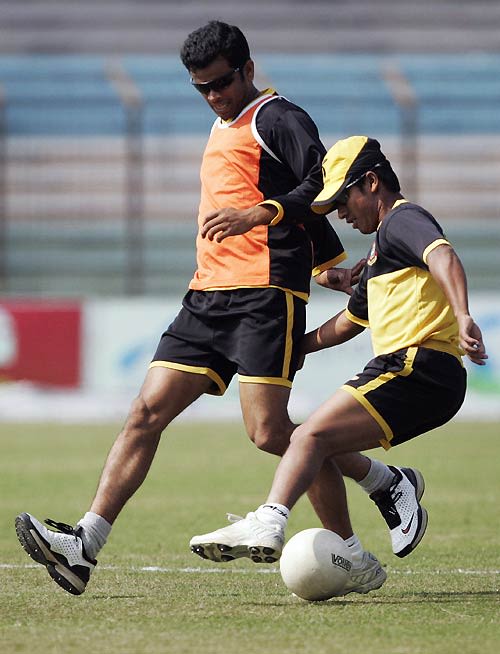 Abdur Razzak and Mohammad Ashraful display their skills at soccer ...