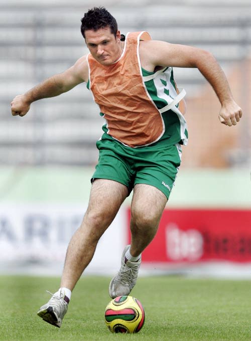 Graeme Smith shows off his football skills at a practice session ...