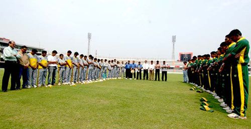 Players of Abahani and City Club and match officials observing a minute ...