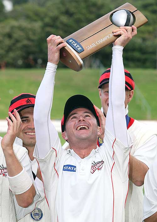 Kruger Van Wyk lifts the trophy | ESPNcricinfo.com